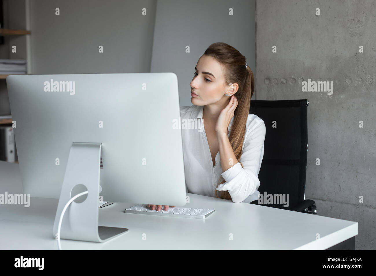 Working at desktop computer hi-res stock photography and images - Alamy