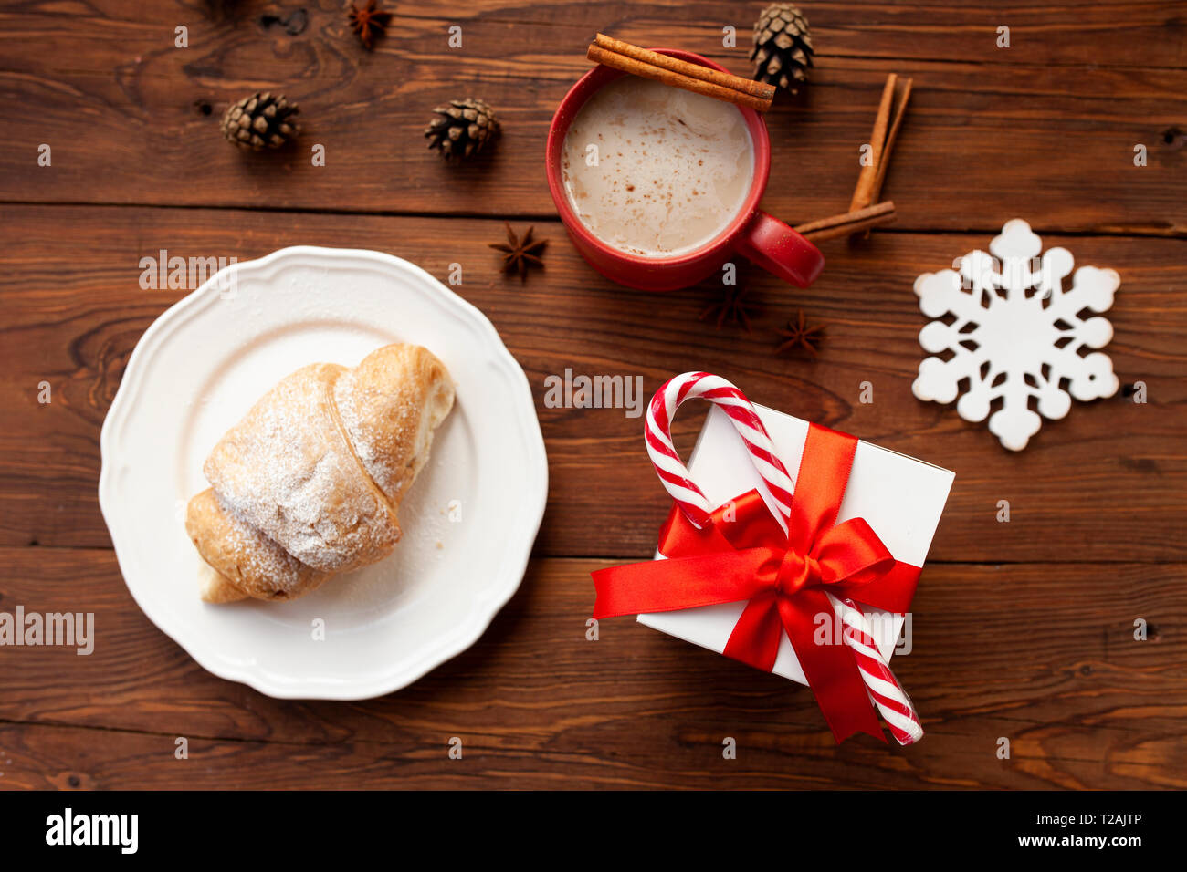 Christmas present and croissant Stock Photo - Alamy