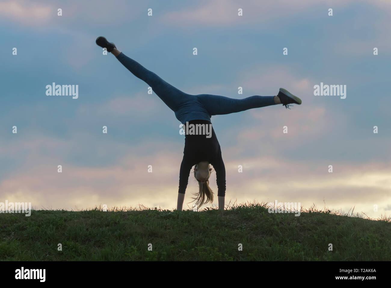 Girl cartwheel handstand hi-res stock photography and images - Alamy