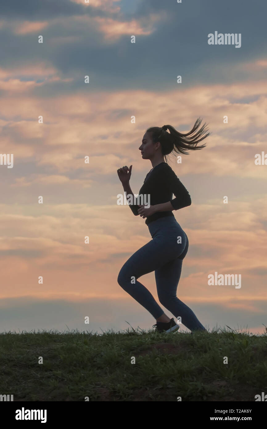 Running woman morning workout. Female Runner. Jogging during sunrise ...