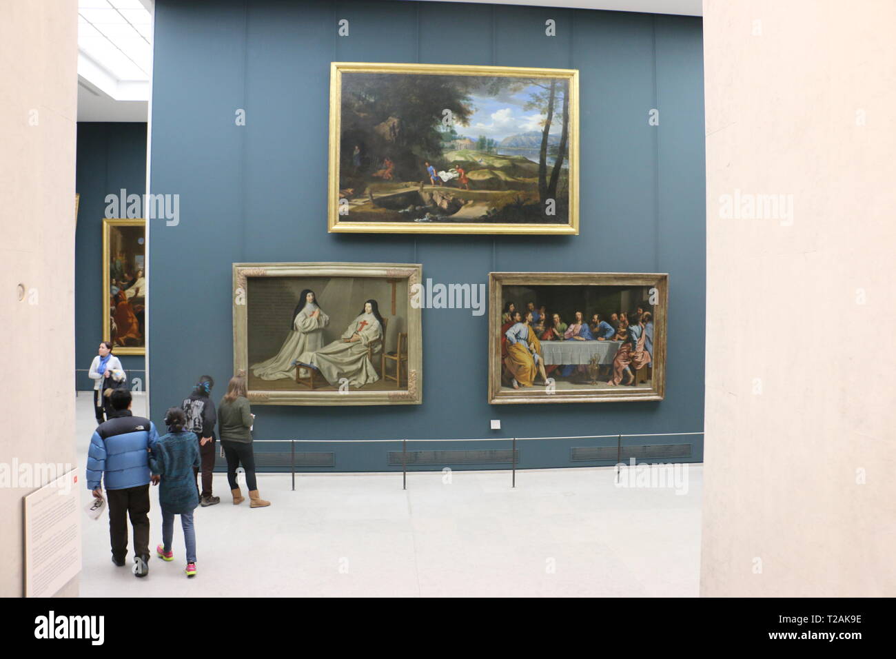 Blue wall at the Louvre museum with different paintings Stock Photo - Alamy
