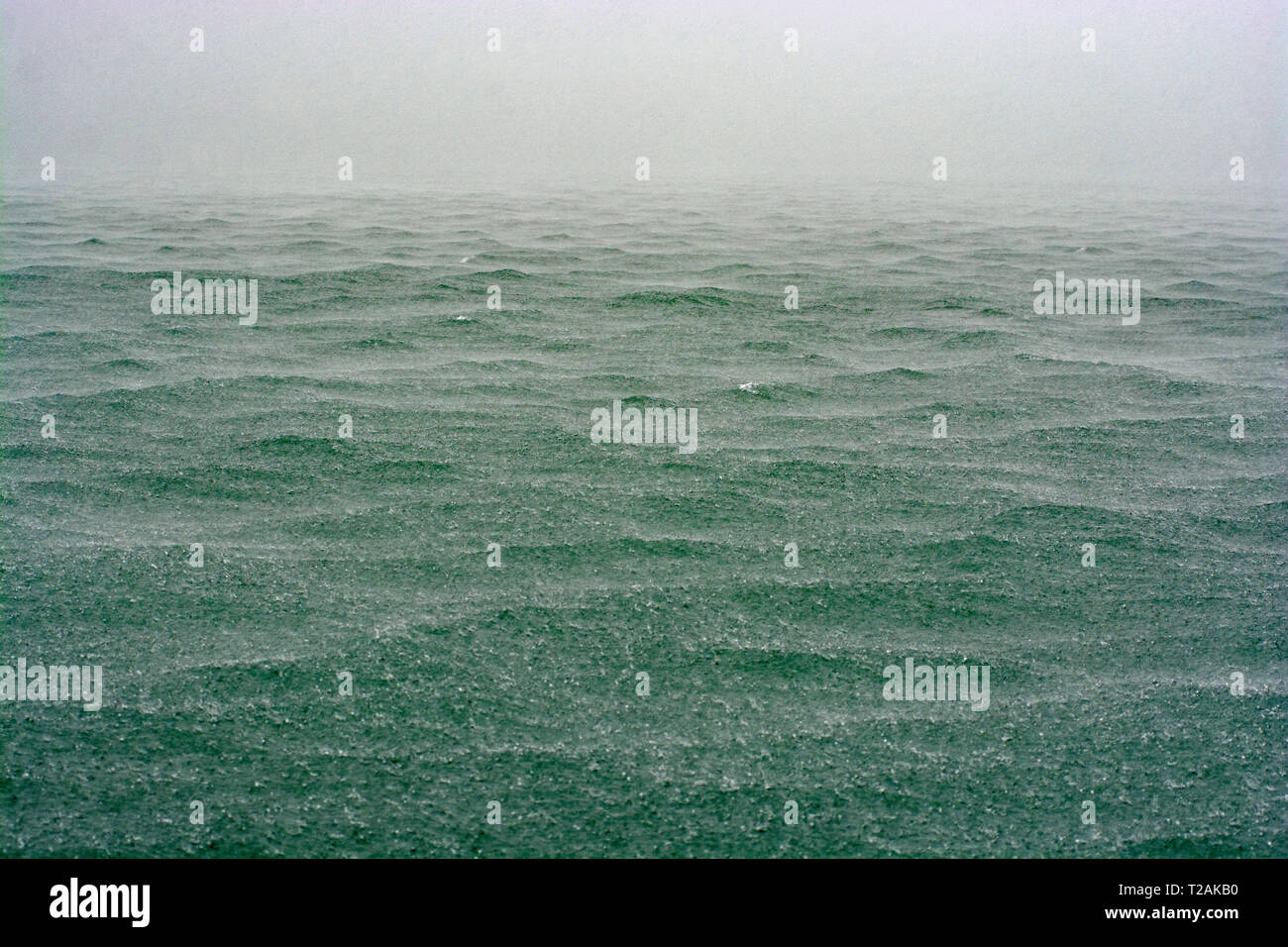Rain on the rippling sea Stock Photo - Alamy