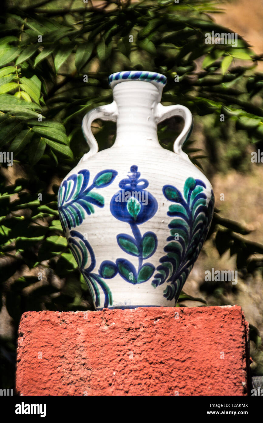 A painted jug on display in front of a building; Granada, Spain Stock ...