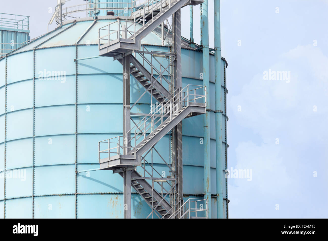 Stairs leading to the sky on a white industrial tank Stock Photo - Alamy