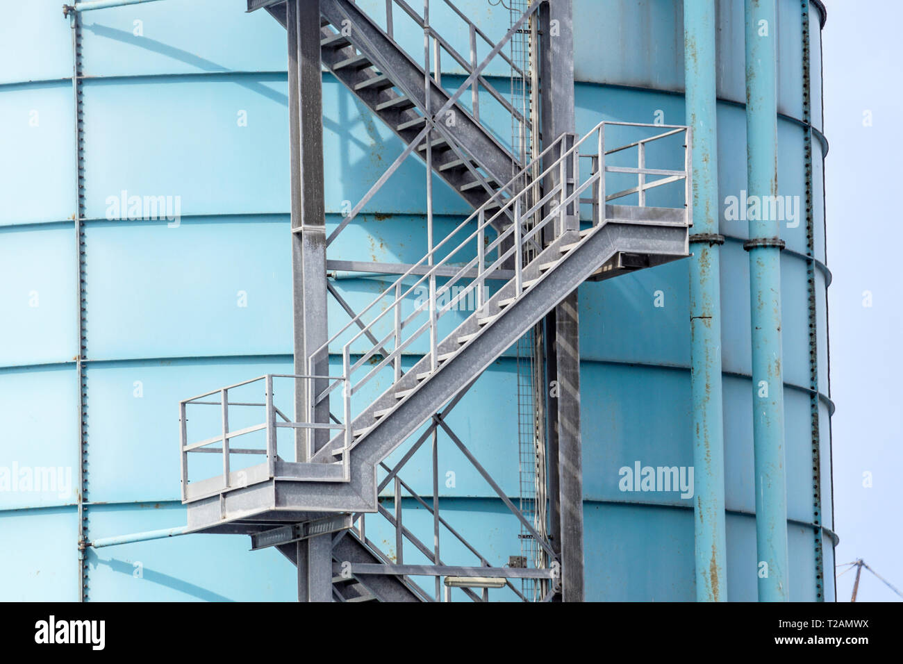 Stairs leading to the sky on a white industrial tank Stock Photo - Alamy