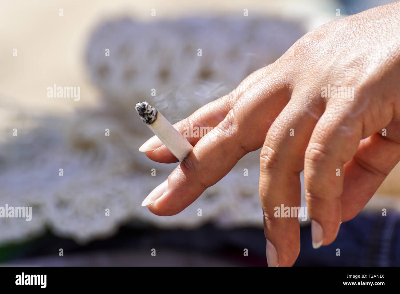 closeup woman hand smoking cigarette ,unhealthy lifestyle concept Stock ...