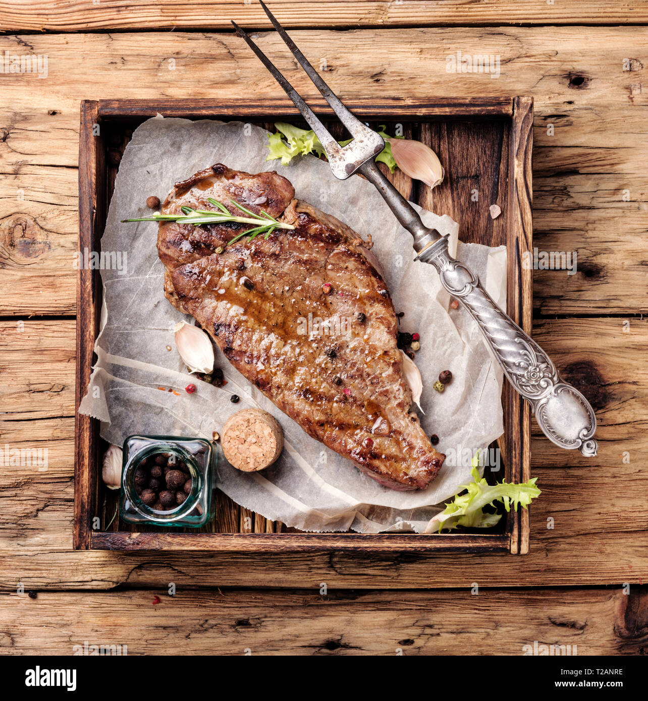 Grilled ribeye beef steak, herbs and spices.Delicious festive steak ...