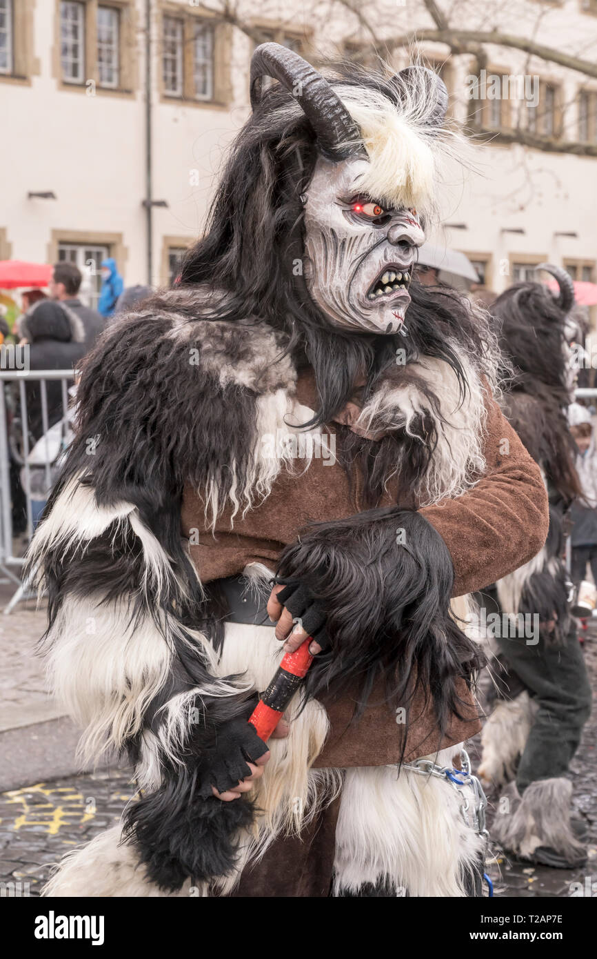 STUTTGART, GERMANY - MARCH 5: raged furry devil mask in parade under ...