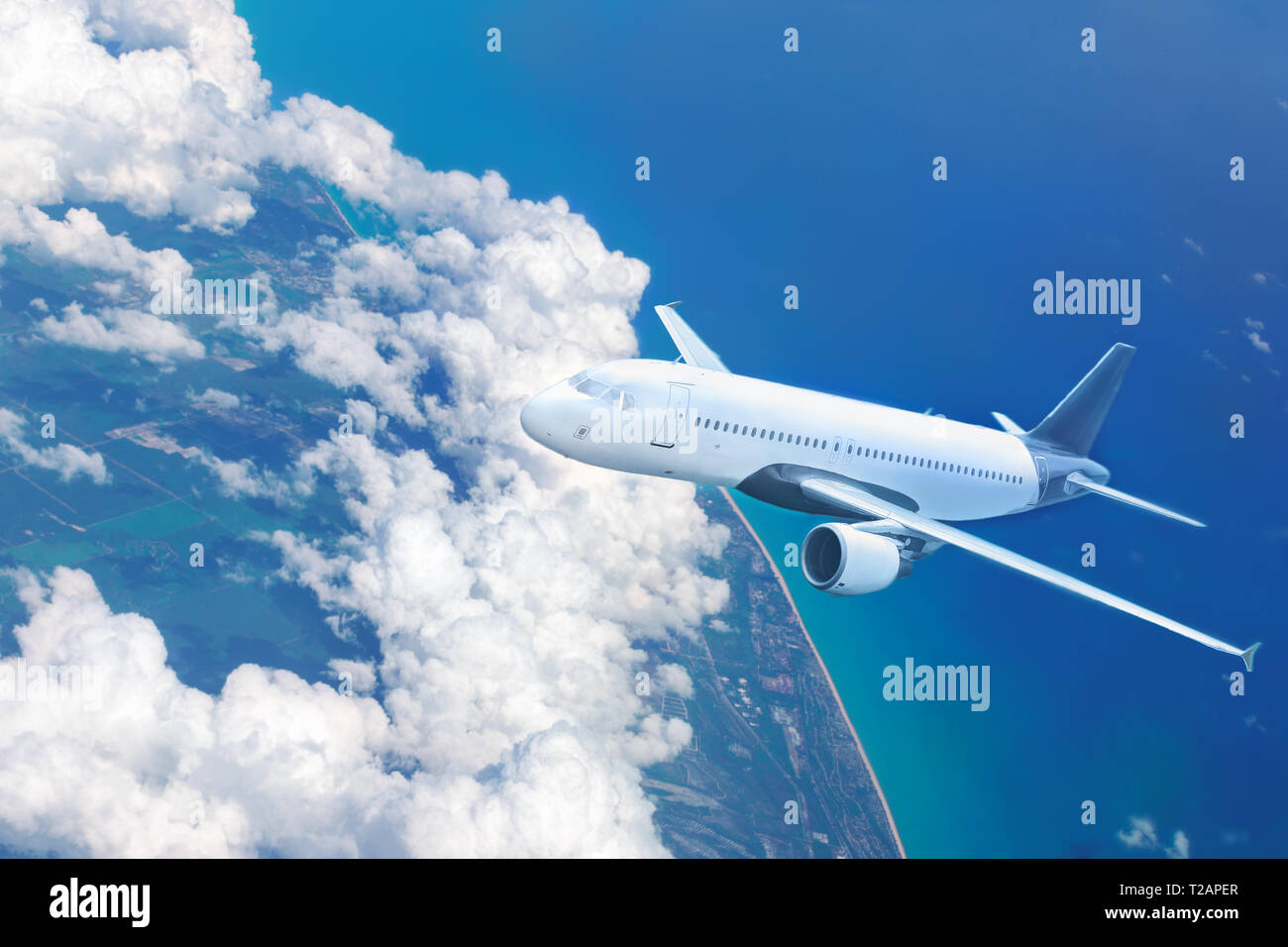 Plane over island hi-res stock photography and images - Alamy