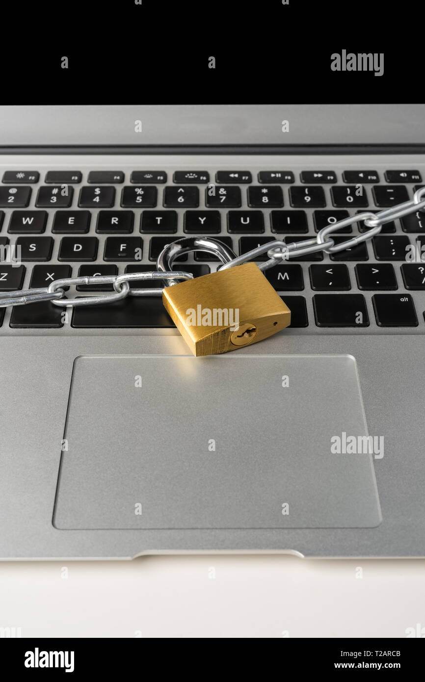 Padlock with chain on a laptop computer keyboard. Cyber security ...