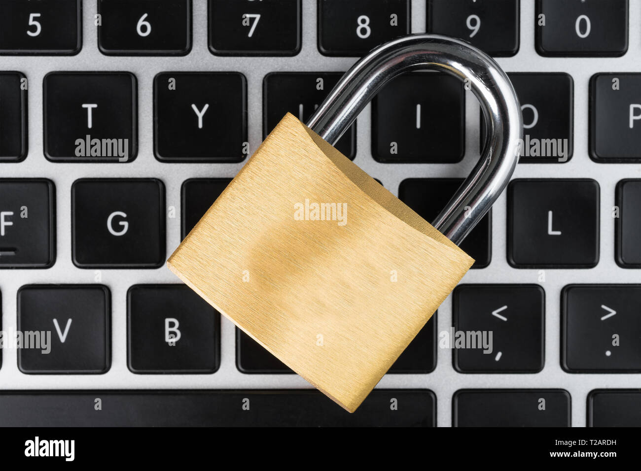 Padlock on a laptop computer keyboard. Cyber security abstract concept ...