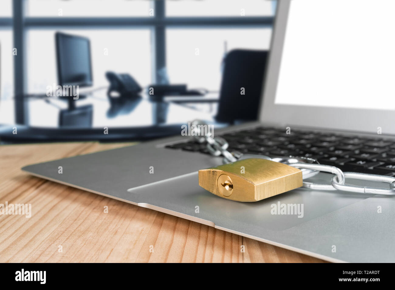 Padlock and chain with laptop computer in a presentation board office ...