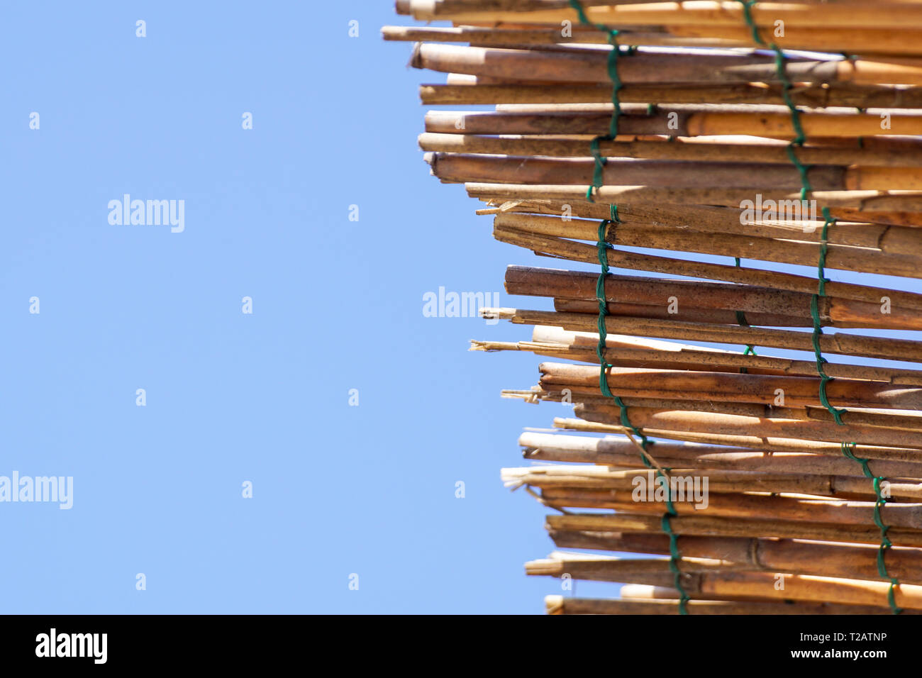 A homemade beach canopy made of crochet on a metal frame. The roof of a ...