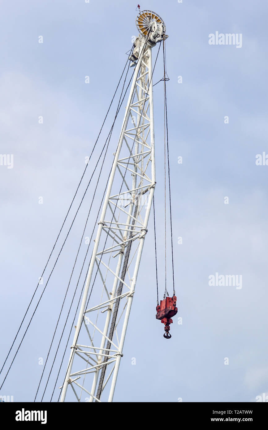 Cranes unloading a ship in a harbor Stock Photo - Alamy