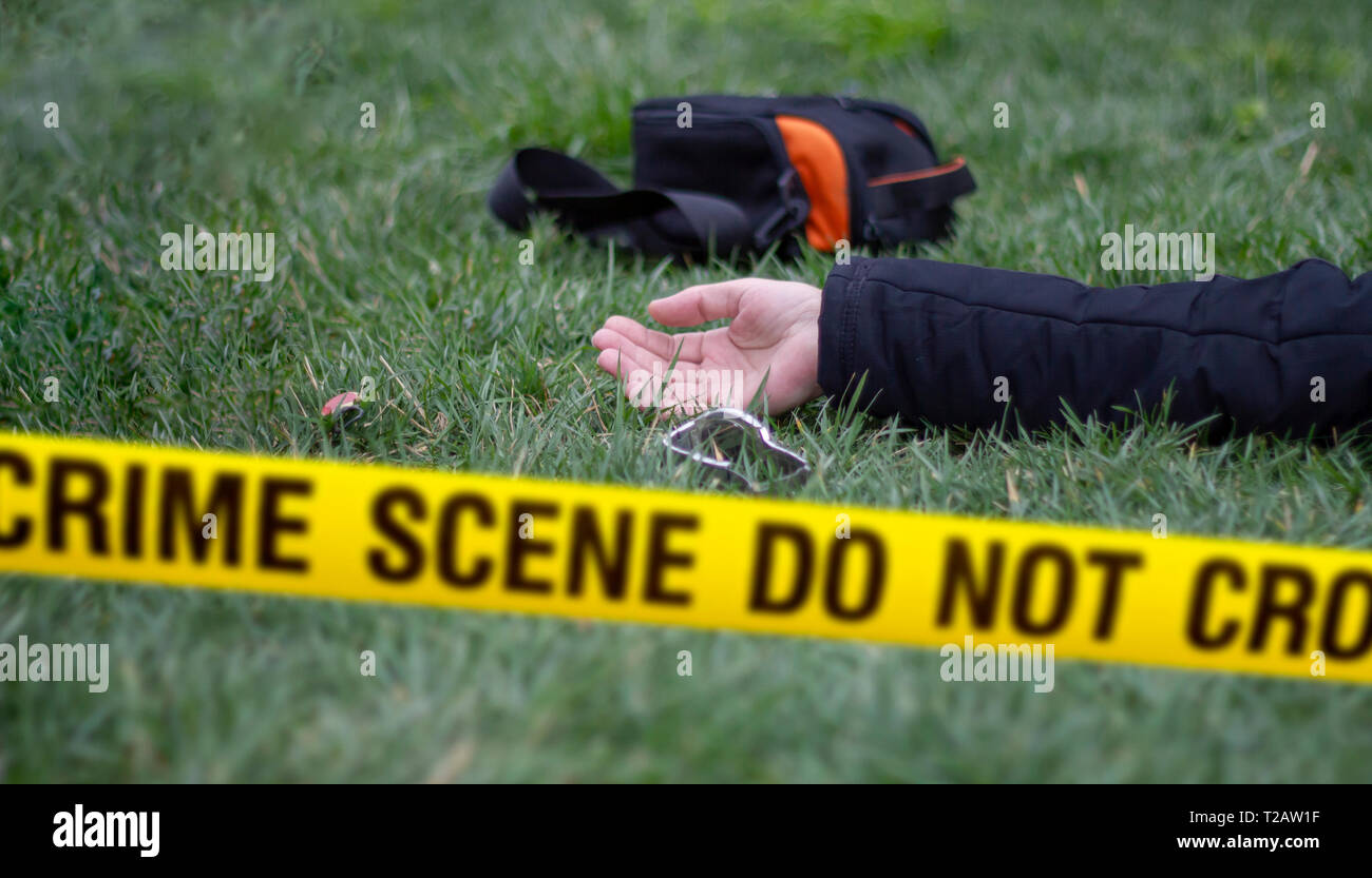 Crime scene tape hand hi-res stock photography and images - Alamy