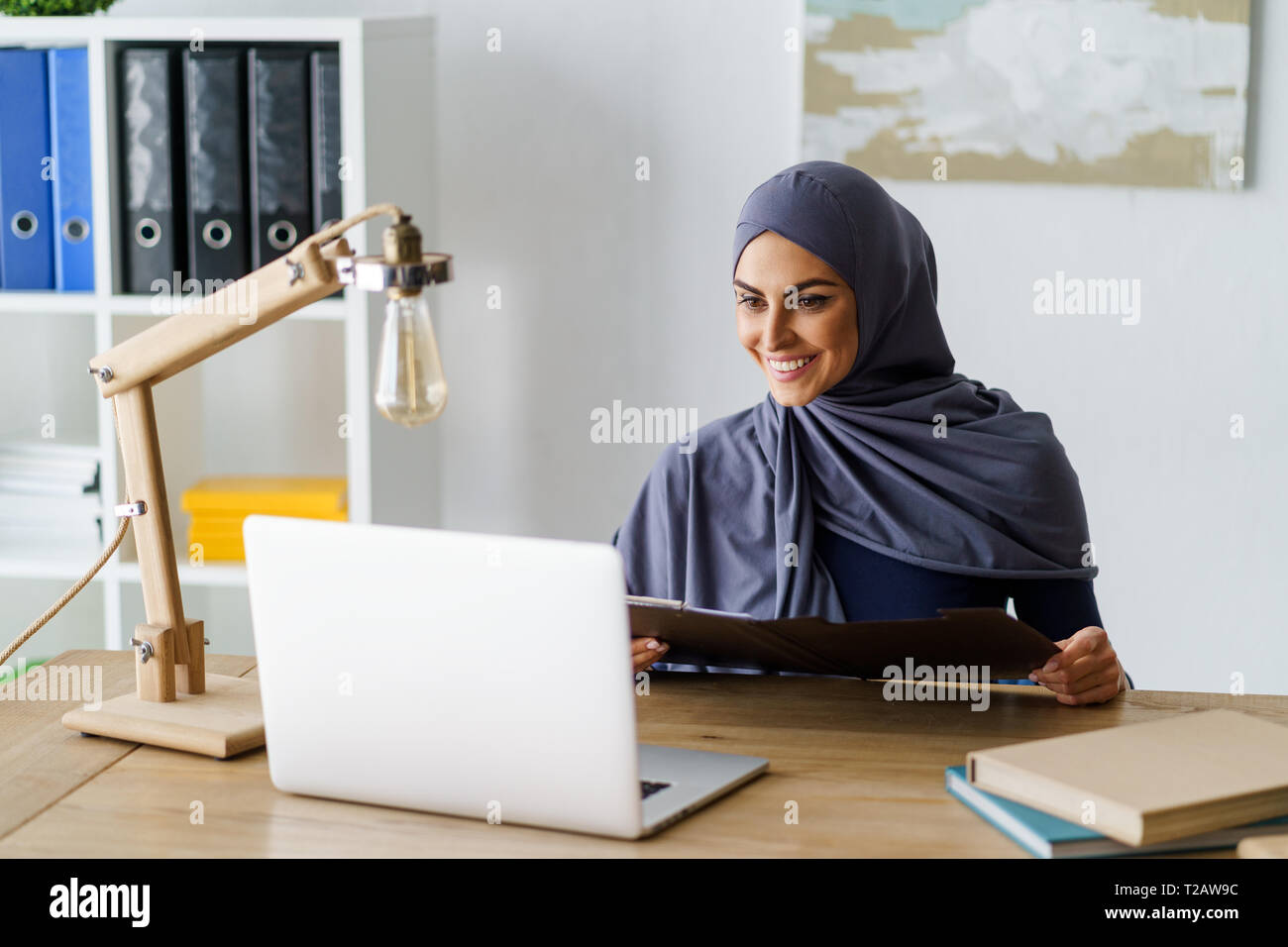 Muslim woman working in office Stock Photo - Alamy