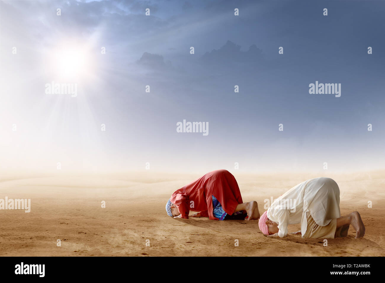 Rear view of two asian muslim man praying in prostration position on ...
