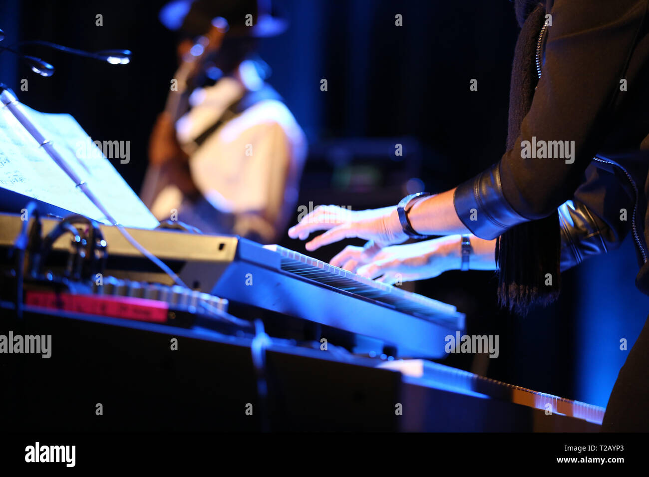 hands of musician playing keyboard in concert Stock Photo - Alamy