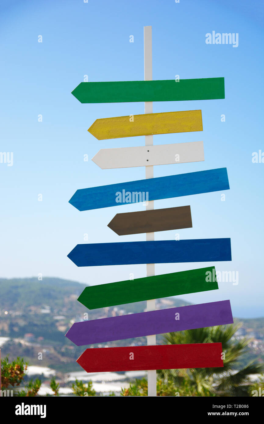 direction sign with blank spaces for text on beautiful sky background ...