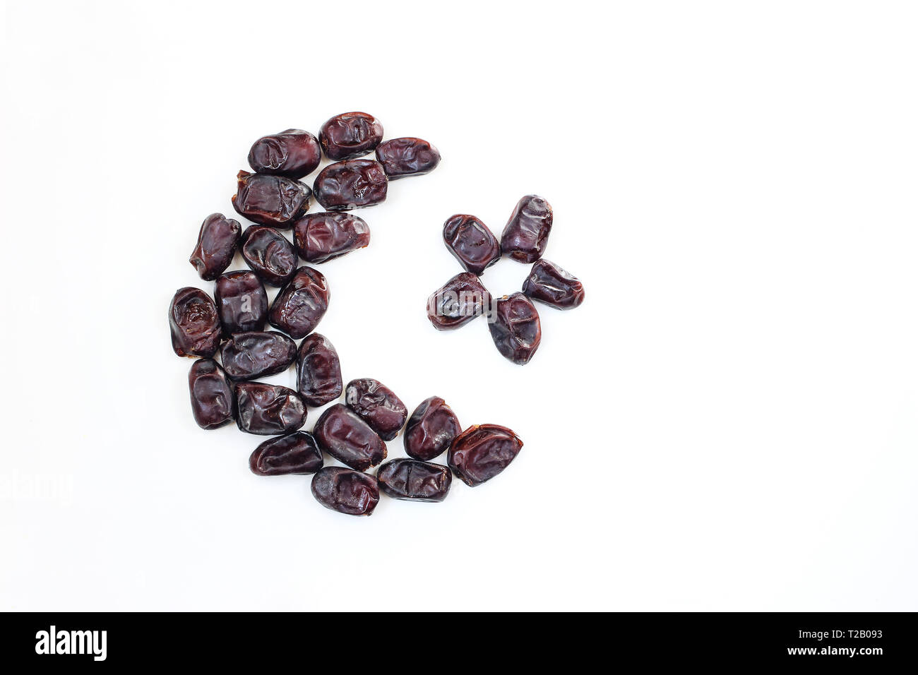Ramadan, iftar table composition. Dried date fruit arranged in moon and ...