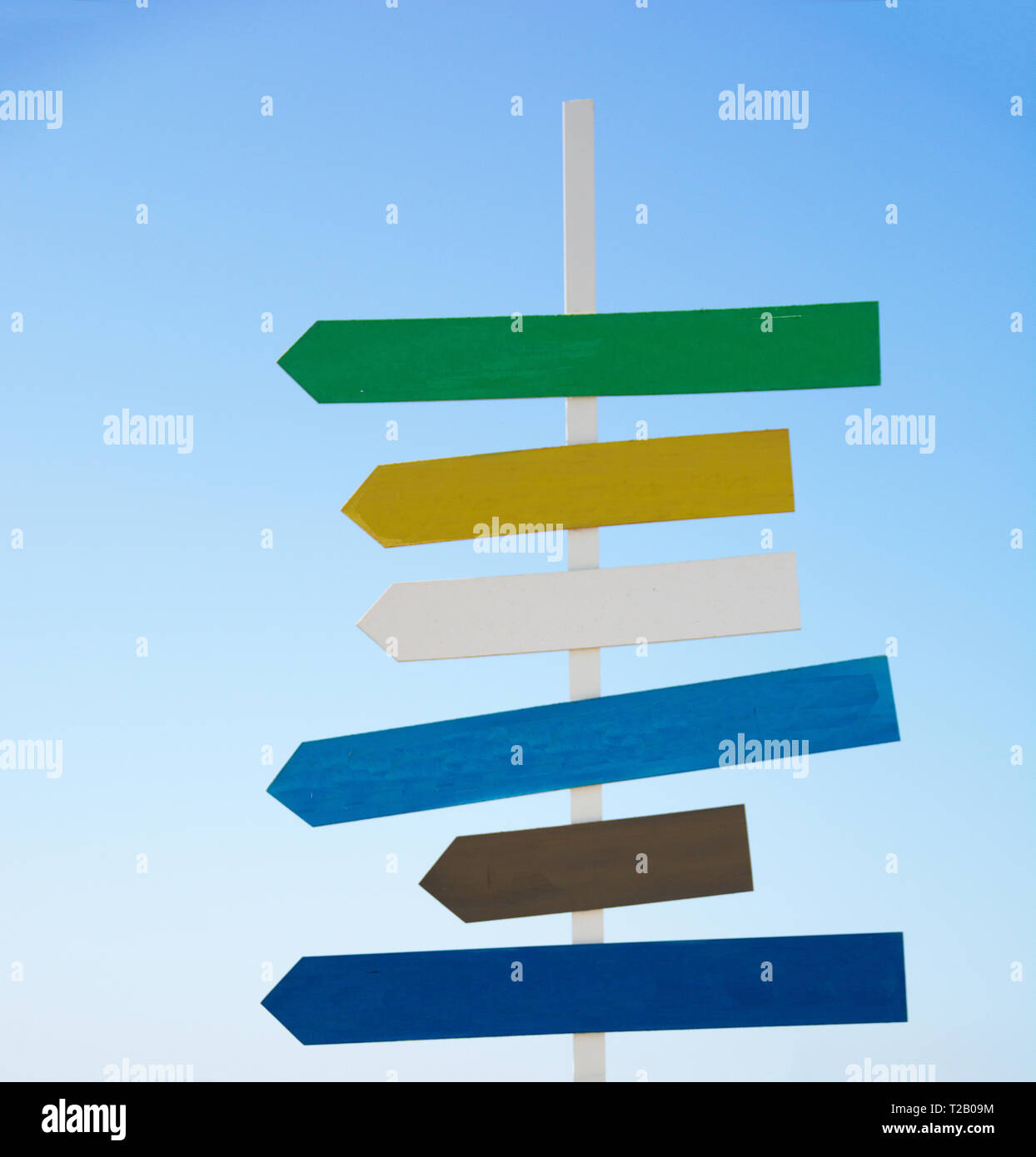 direction sign with blank spaces for text on beautiful sky background ...