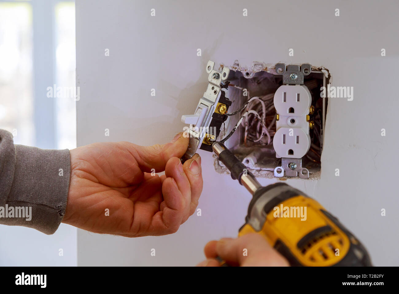 Installing a light switch hi-res stock photography and images - Alamy