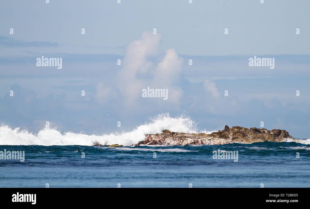 Waves crash against the rocks at Port Wemyss, Islay, Scotland Stock ...