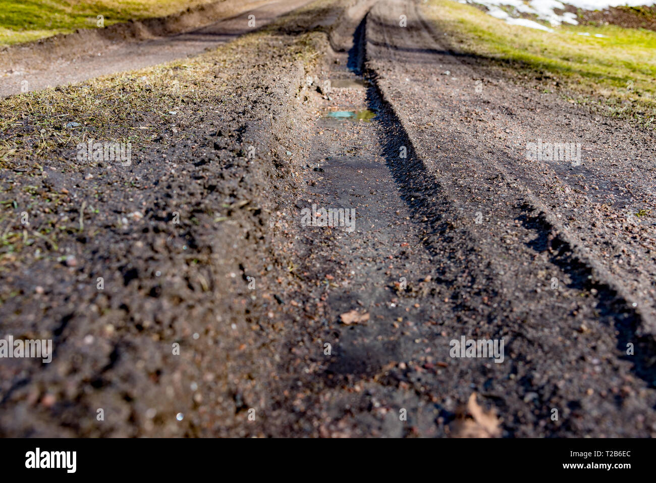 deep tire tracks in a dirt road in sweden spring of 2019 Stock Photo ...