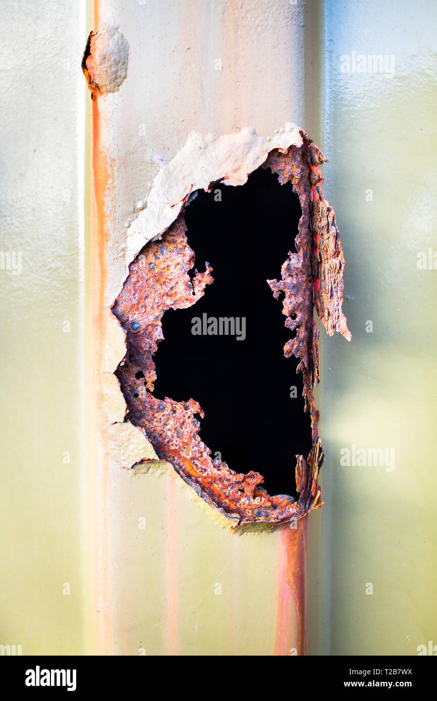 Layers of old paint peeling off a metal container at the abandoned ...