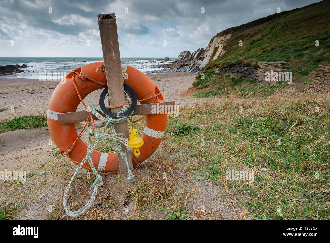 Life Ring at the top of the beach, Ayrmer Cove South Devon Stock Photo ...