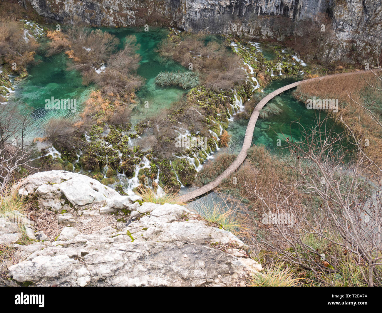 Lakes and wooden bridge in national nature park Plitvice in Croatia ...