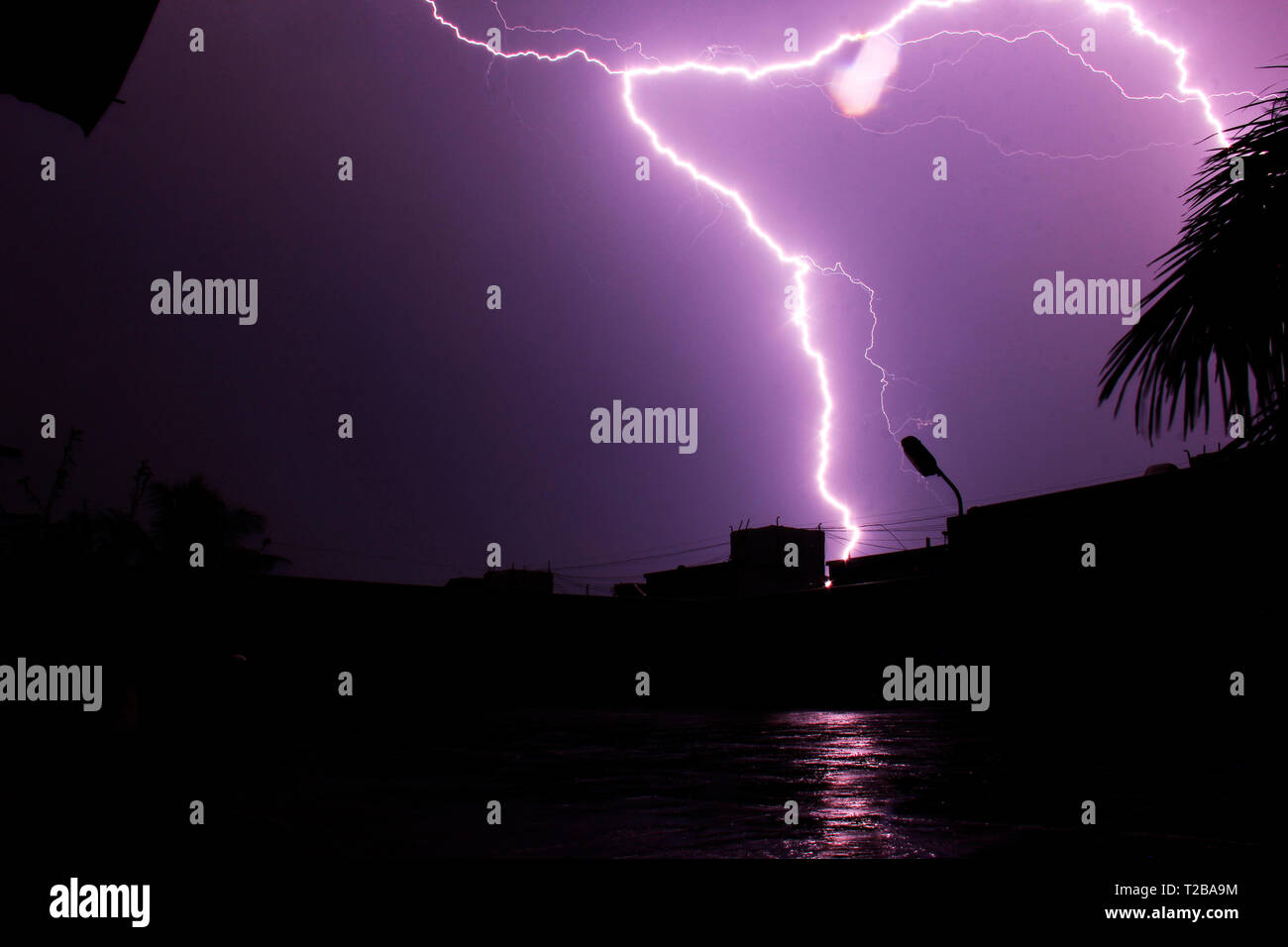 Lightning hitting building top at Pune, India Stock Photo - Alamy