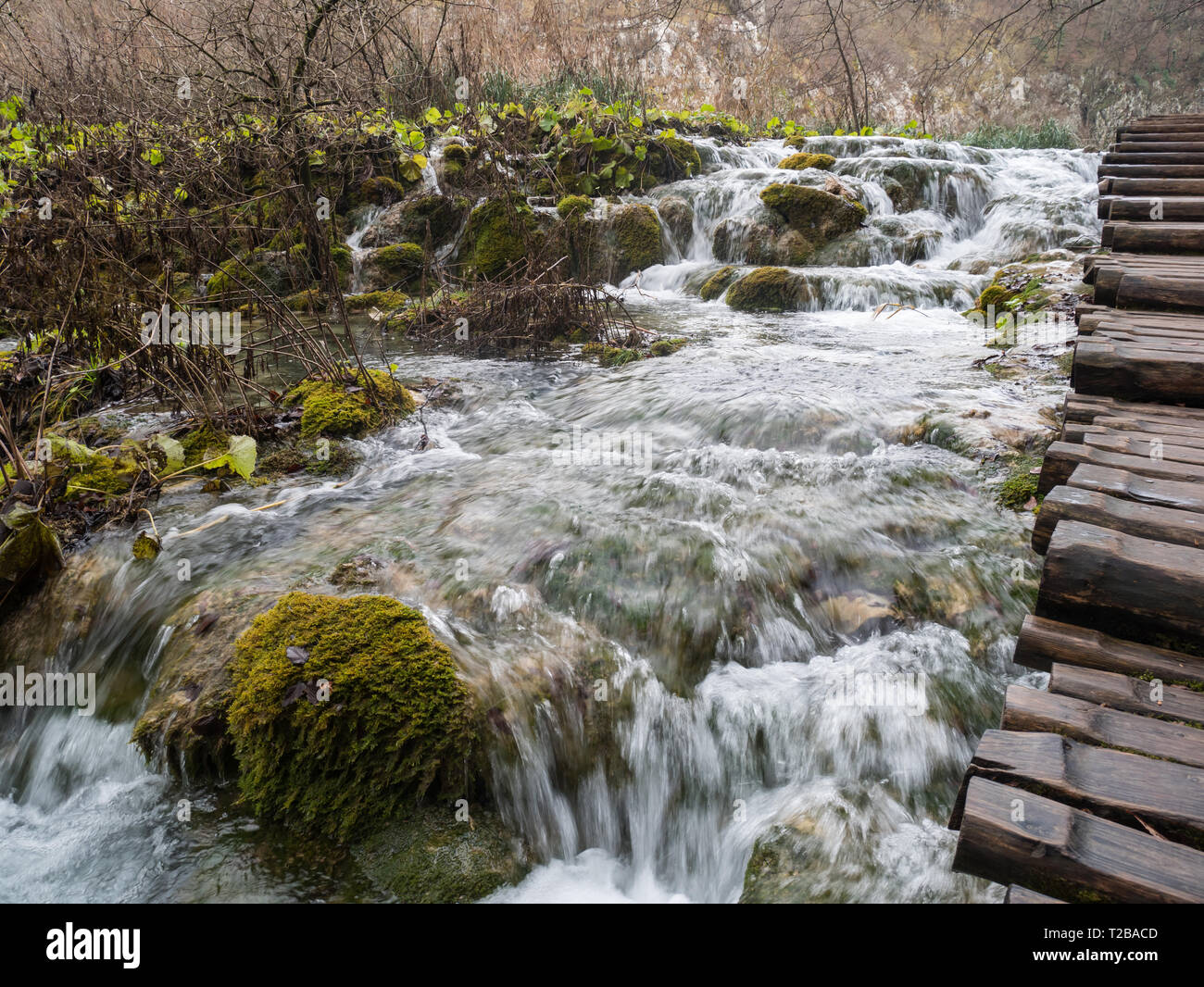 Stream near wooden bridge in nature park Plitvice lakes in Croatia ...