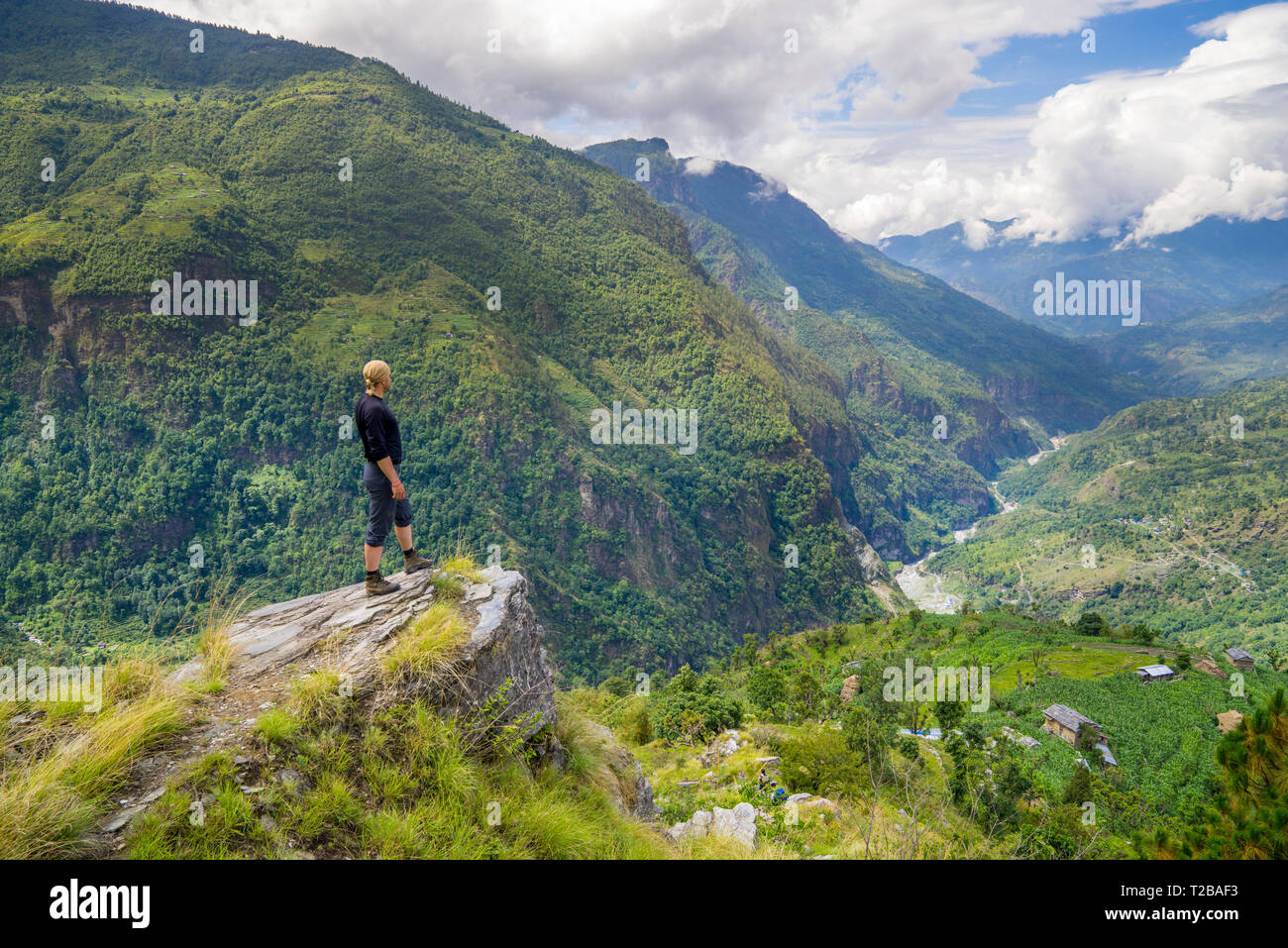Man standing on top of the hill in Himalayas. Achievement and success ...
