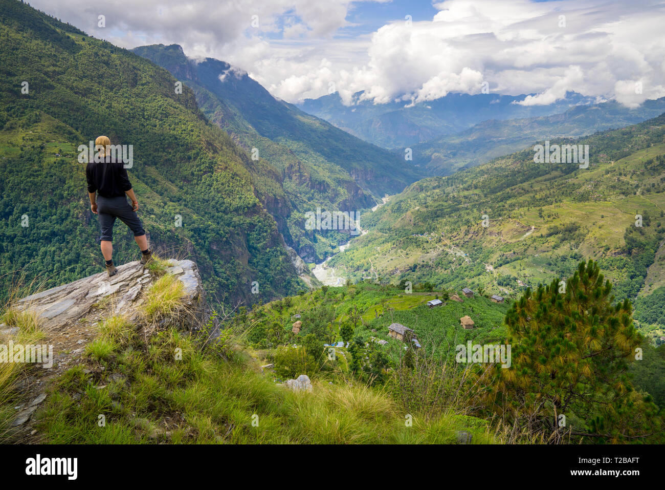 Man standing on top of the hill in Himalayas. Achievement and success ...