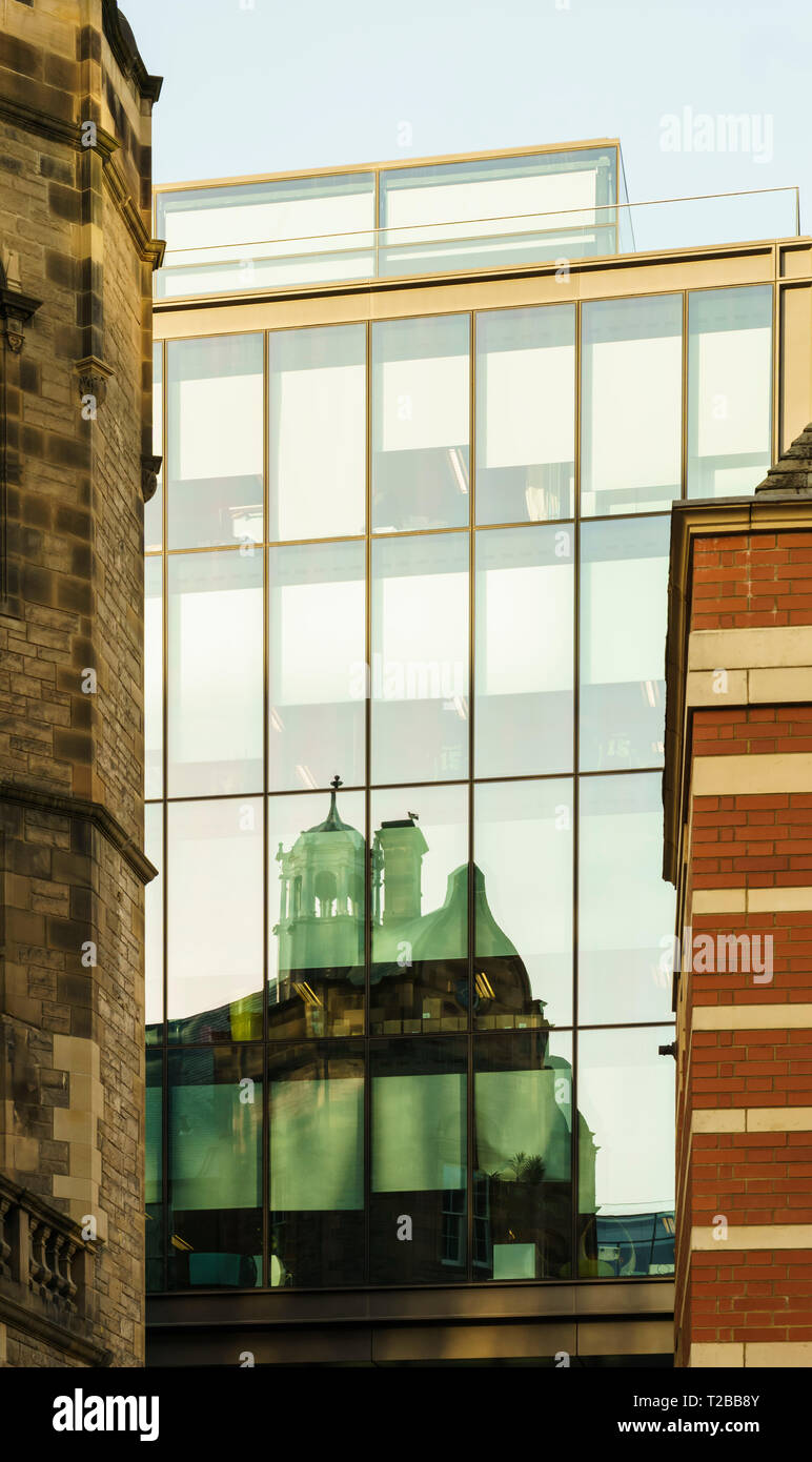 Old hospital buildings, repurposed as apartments, reflected in the ...