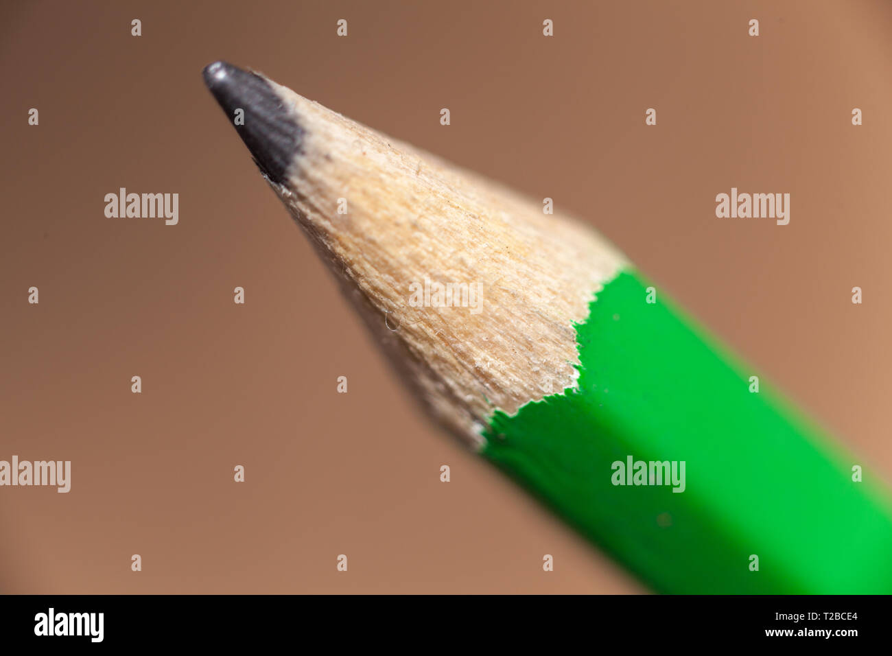 green coloured graphite pencil straight up on a fuzzy background Stock ...