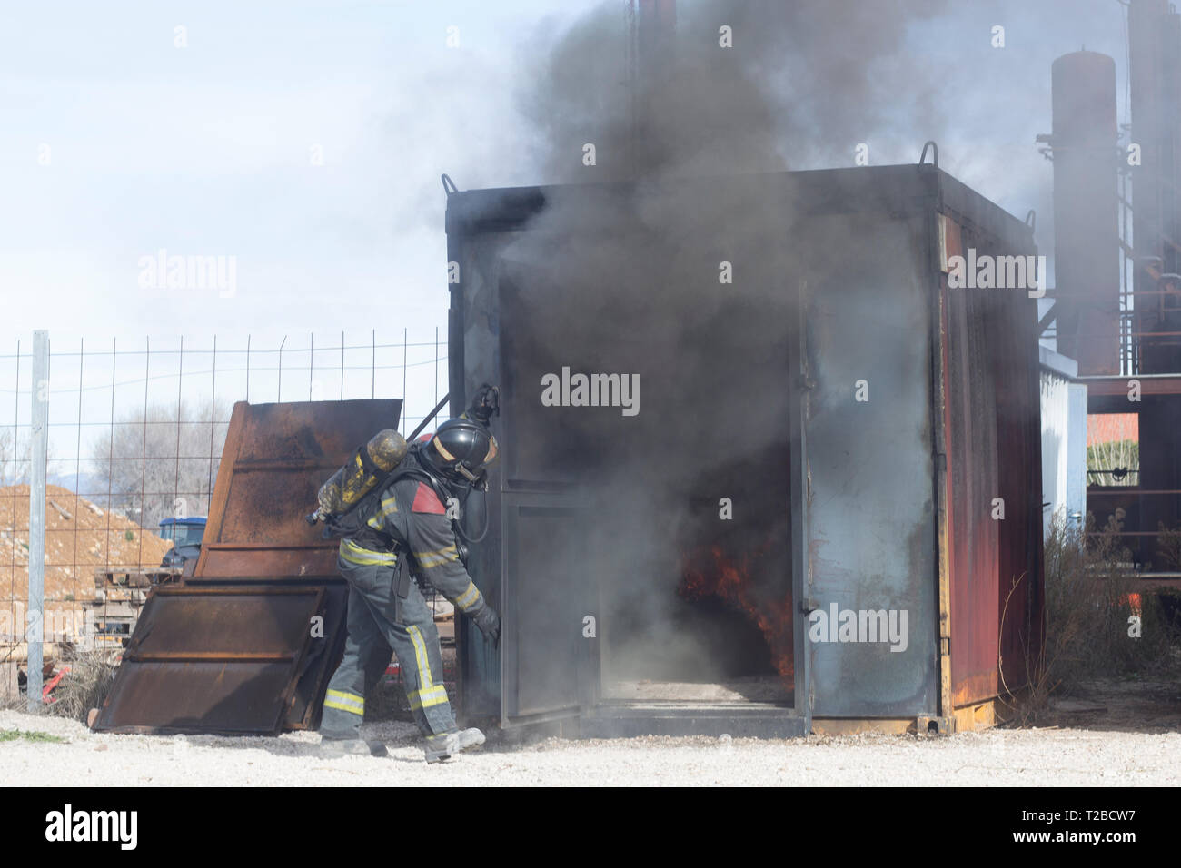 Firefighter putting out fire training station extinguisher backdraft ...