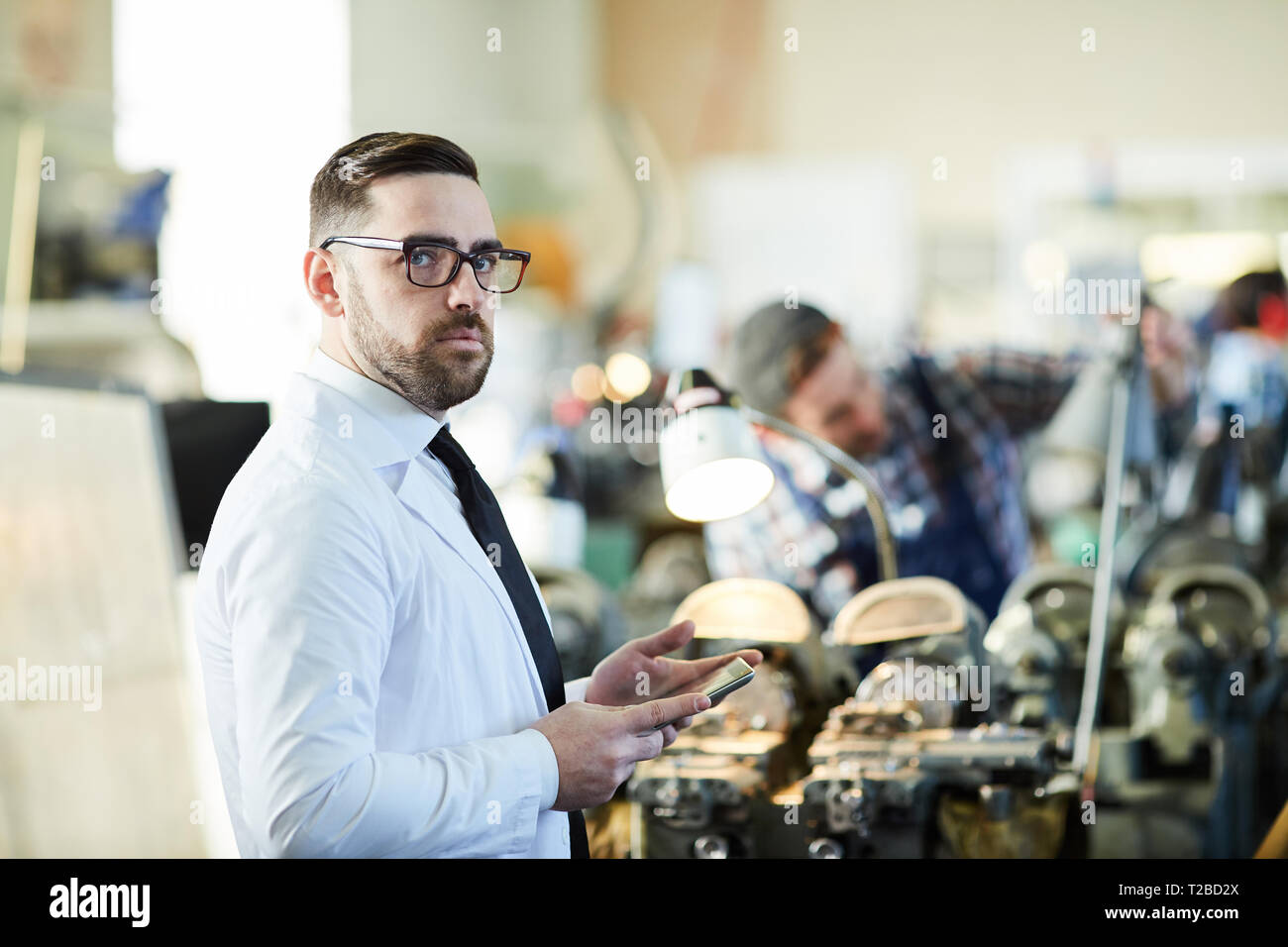 Factory Manager Holding Tablet Stock Photo - Alamy