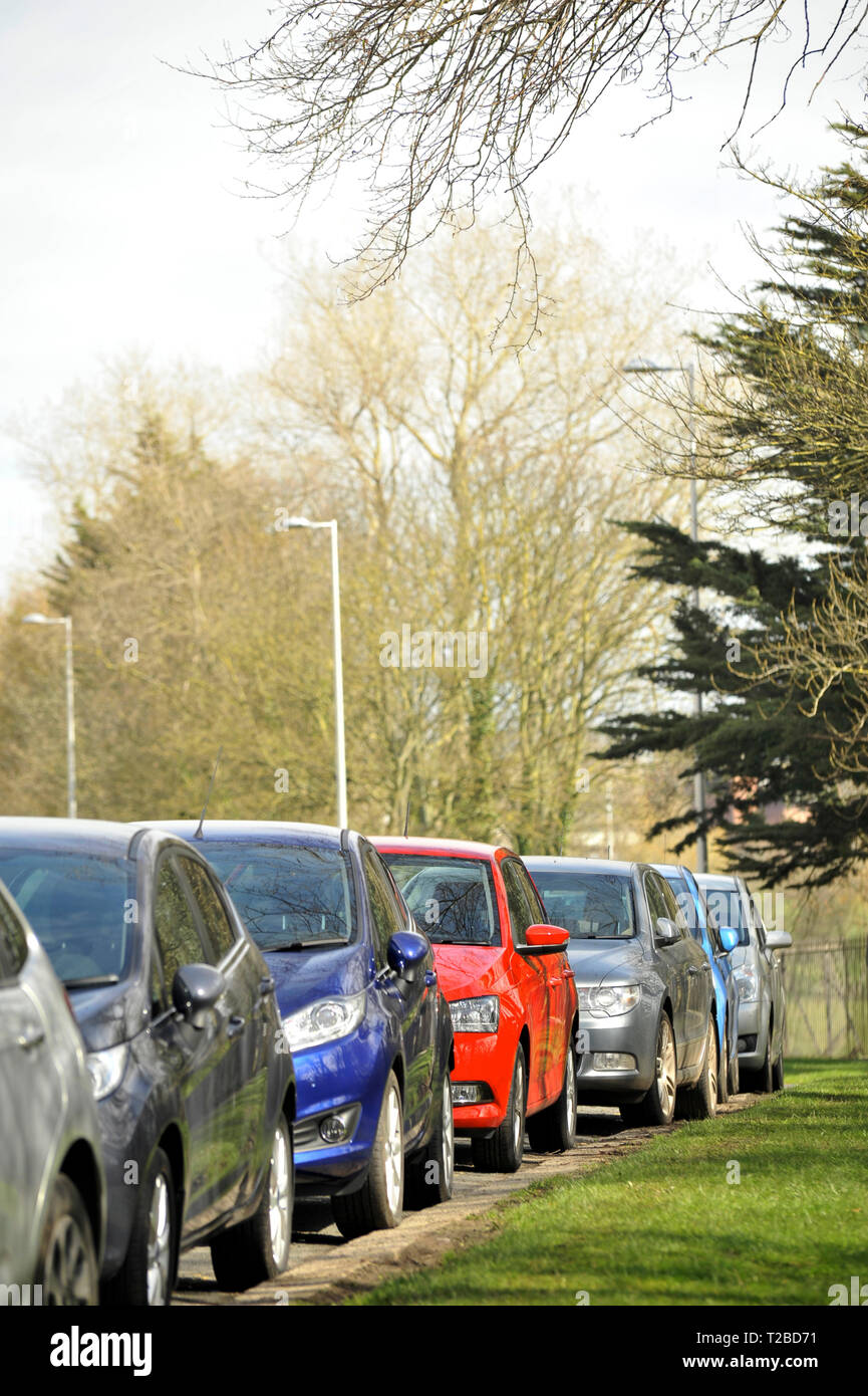 Cars parked close together on rural road Stock Photo - Alamy