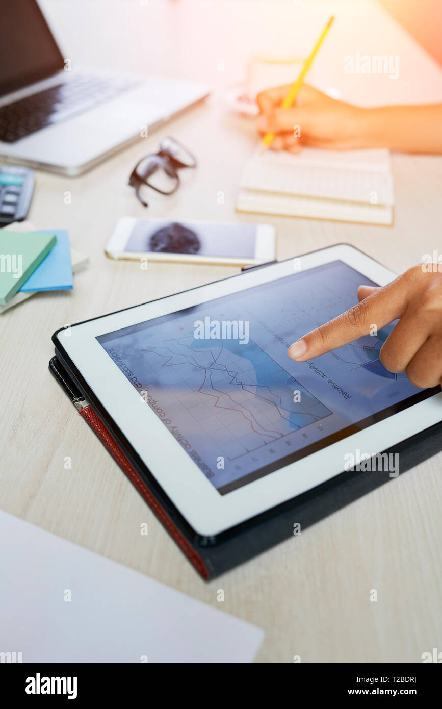 Business person analyzing chart Stock Photo - Alamy