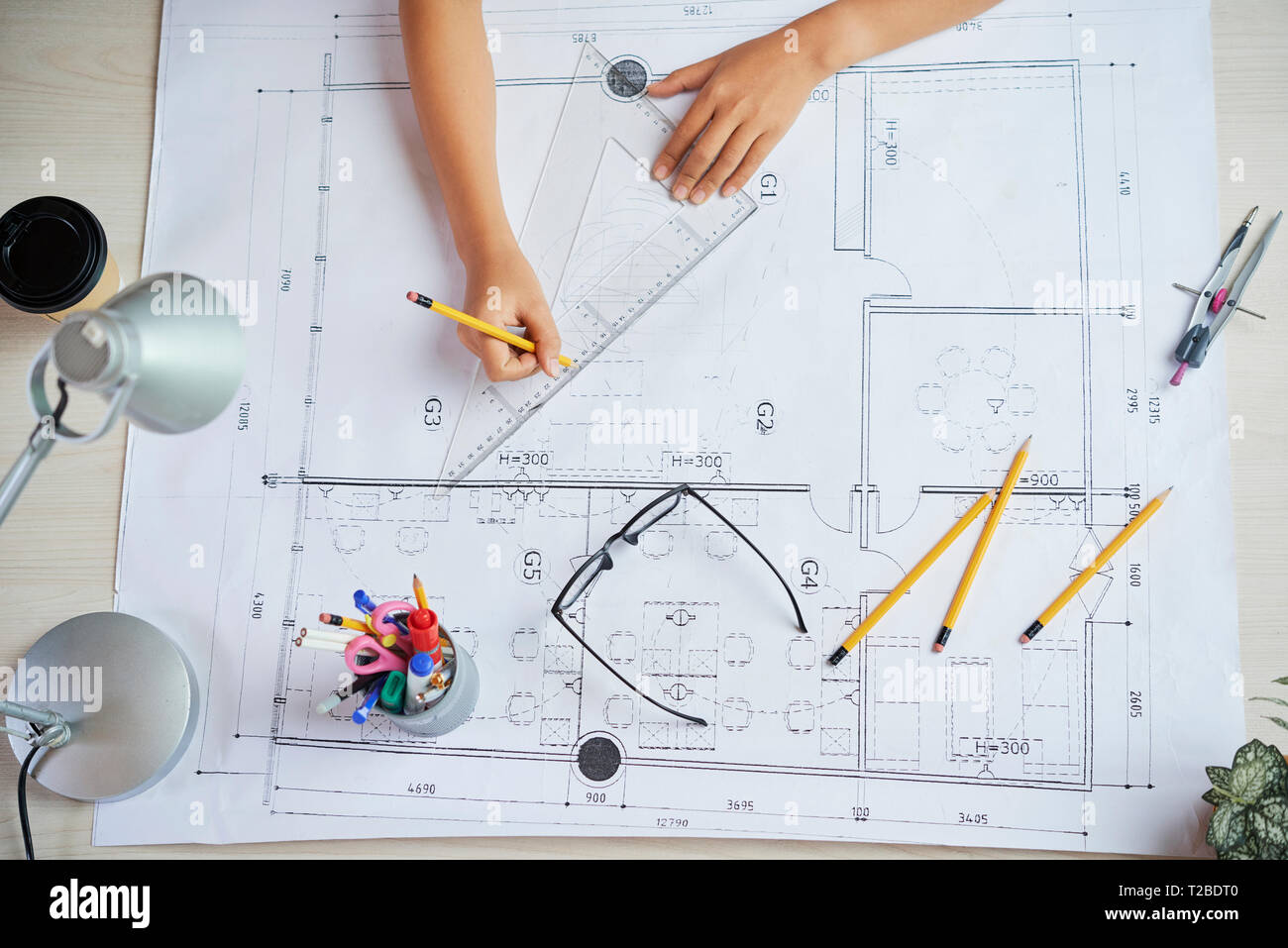 Working on construction plan Stock Photo - Alamy