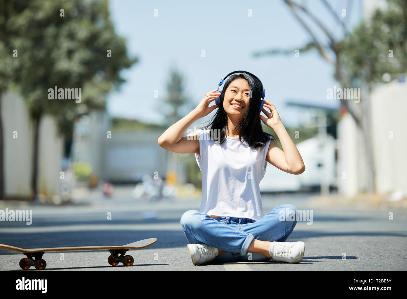 Happy girl enjoying music Stock Photo - Alamy