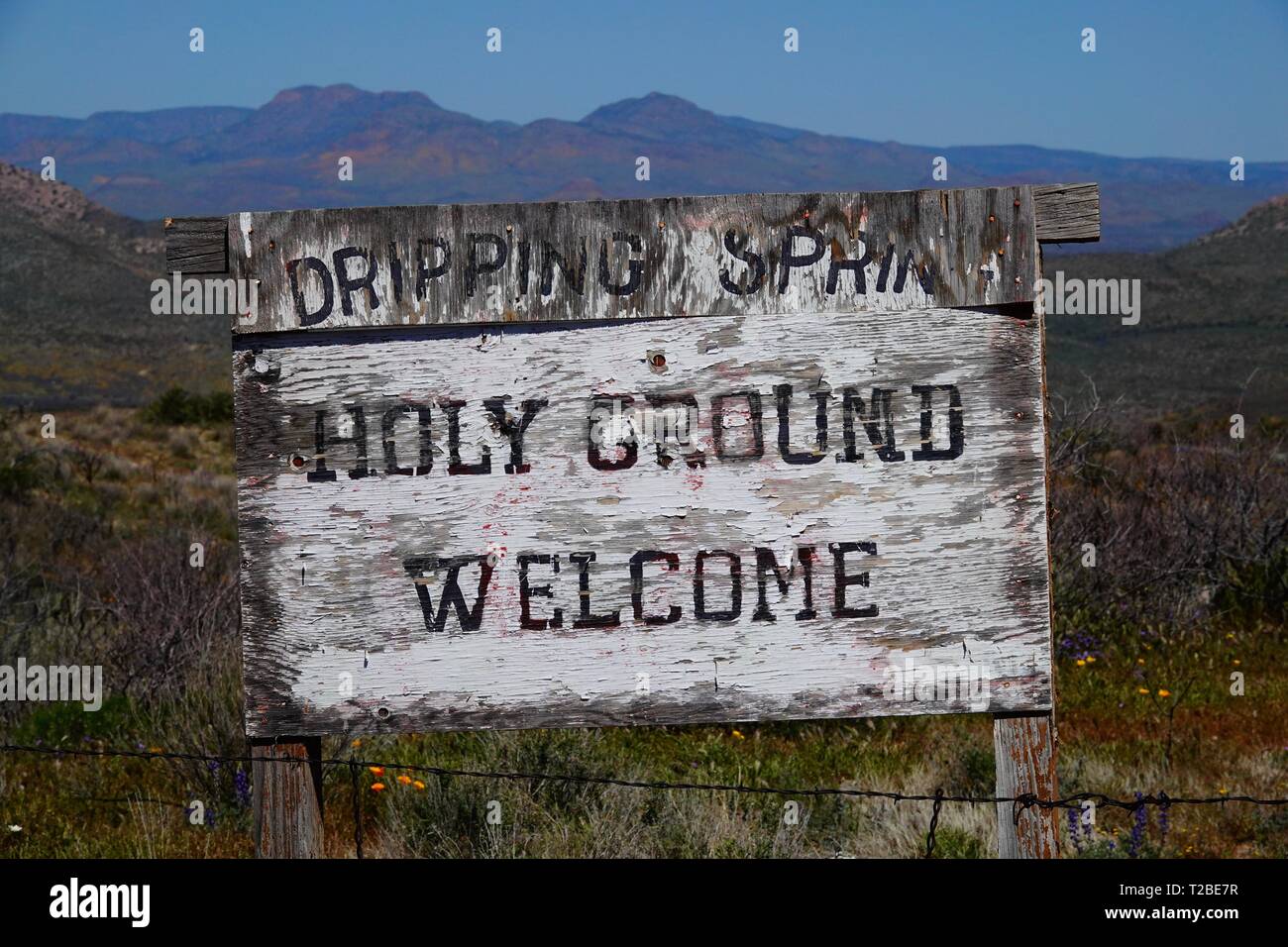 A sign posted in the middle of the desert outside of Globe, Arizona ...