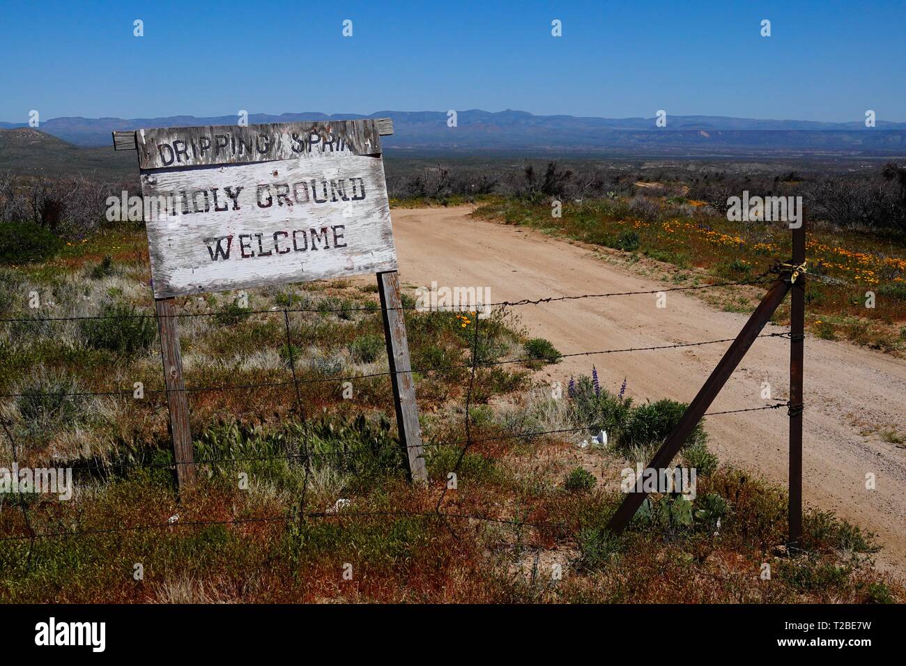 A sign posted in the middle of the desert outside of Globe, Arizona ...