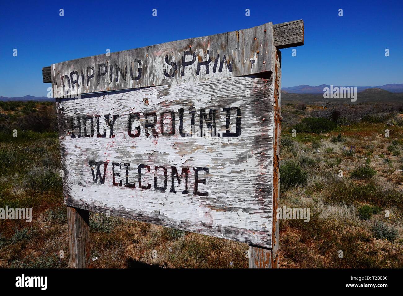 A sign posted in the middle of the desert outside of Globe, Arizona ...
