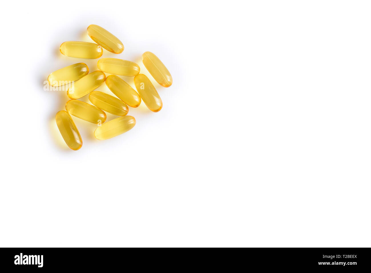 Fish oil pills on a white background - vitamins and dietary supplements ...