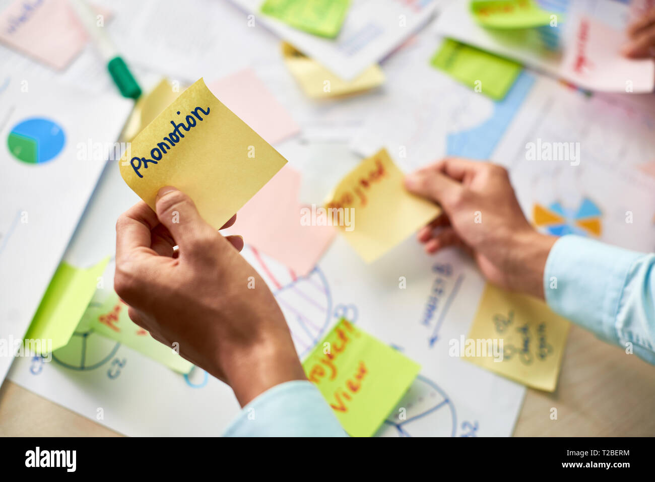 Promotion sticker in hand of businessman Stock Photo - Alamy