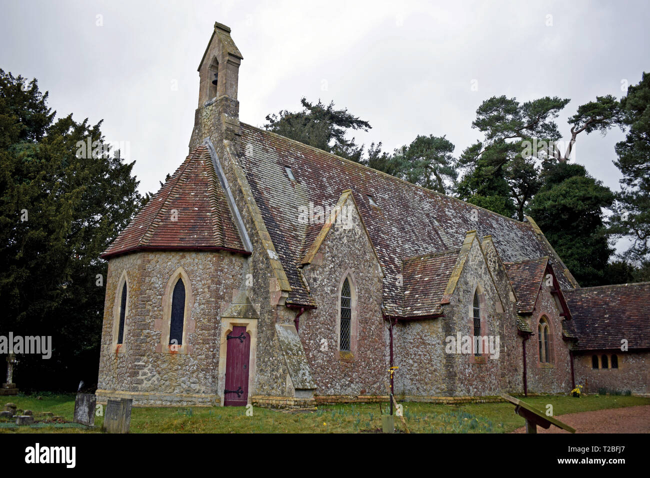 A close up of an old Christian Church in the Churchyard surrounded ...