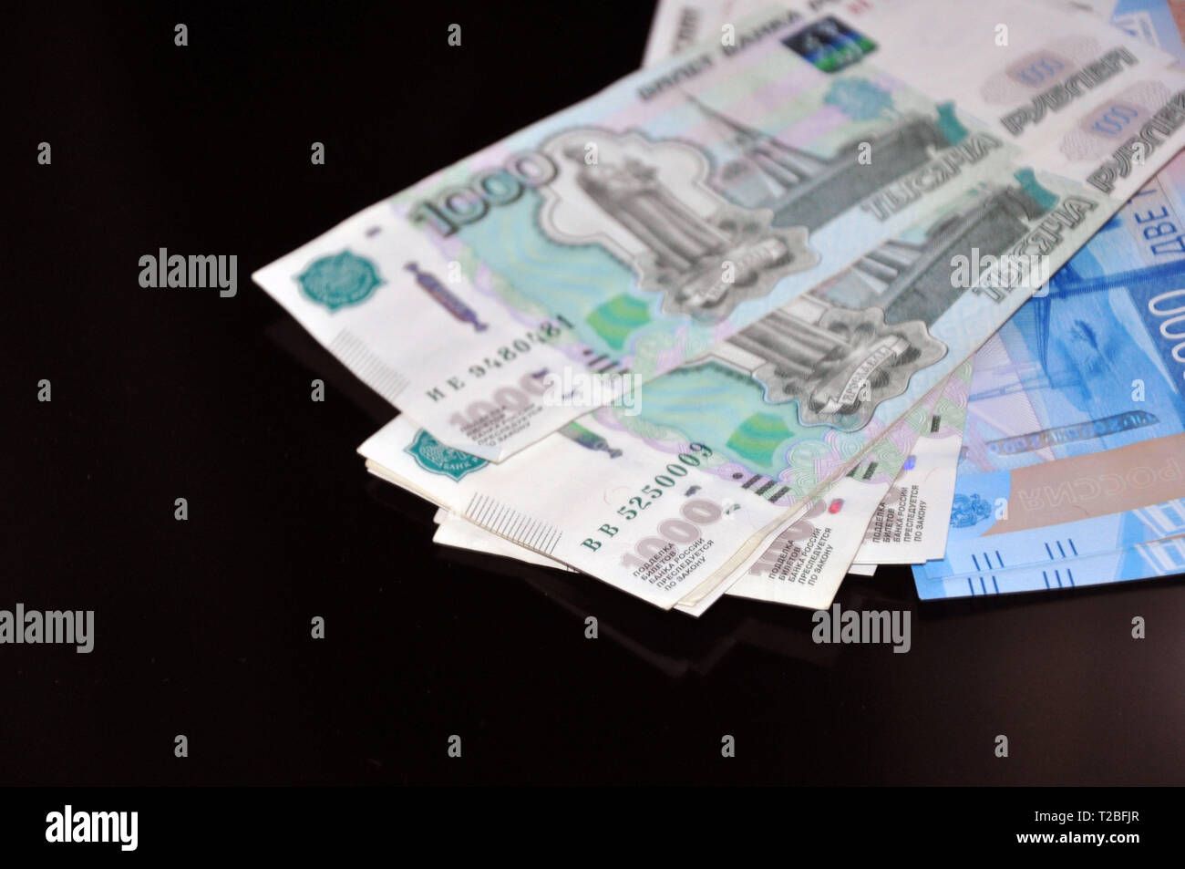 row of various russian banknotes on black background. money Stock Photo ...